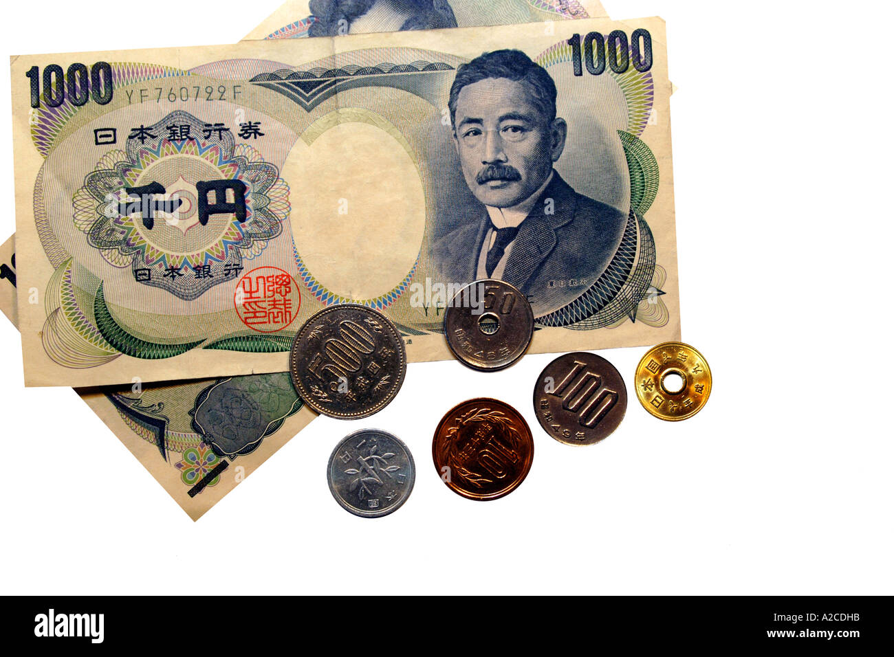 Japanese 1000 Yen notes and coins against a white background Stock ...