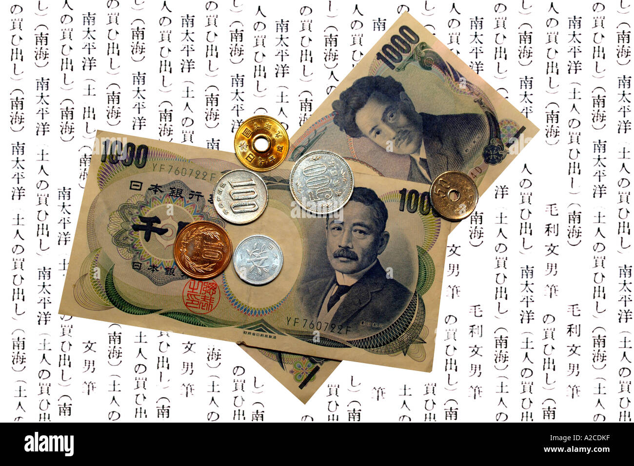 Japanese 1000 Yen notes and coins against a written background Stock ...