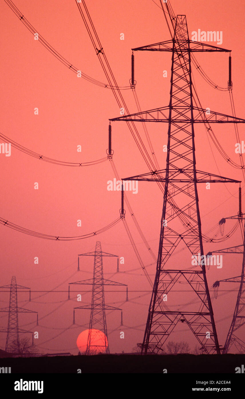 Power lines at sunset in England Stock Photo - Alamy