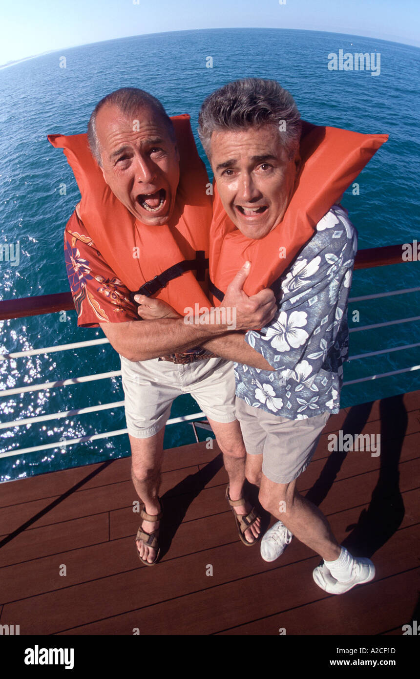 Two scared men in life jactets on cruise ship Stock Photo - Alamy