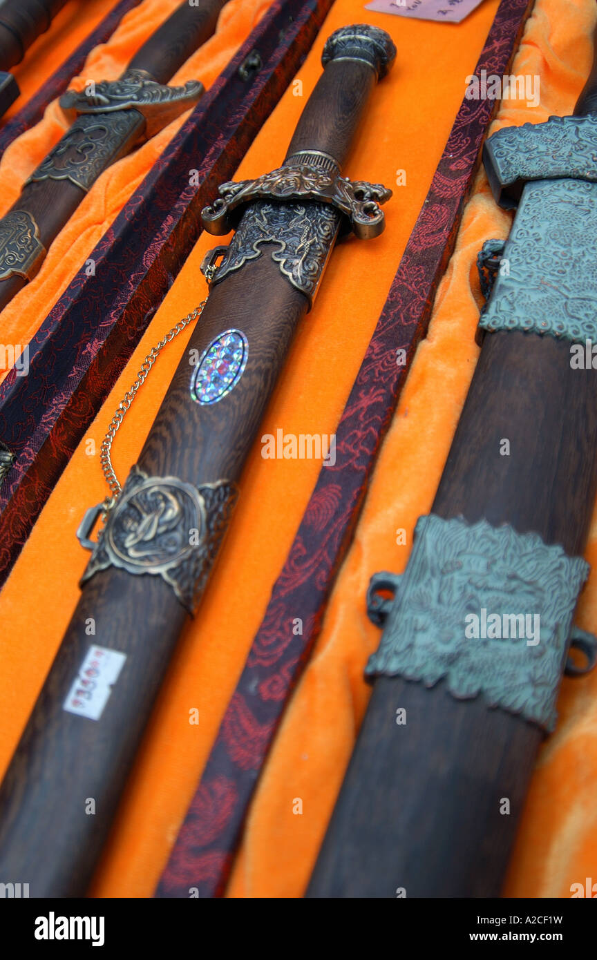Swords on sale at Temple Street Night Market, Kowloon Hong Kong Stock ...