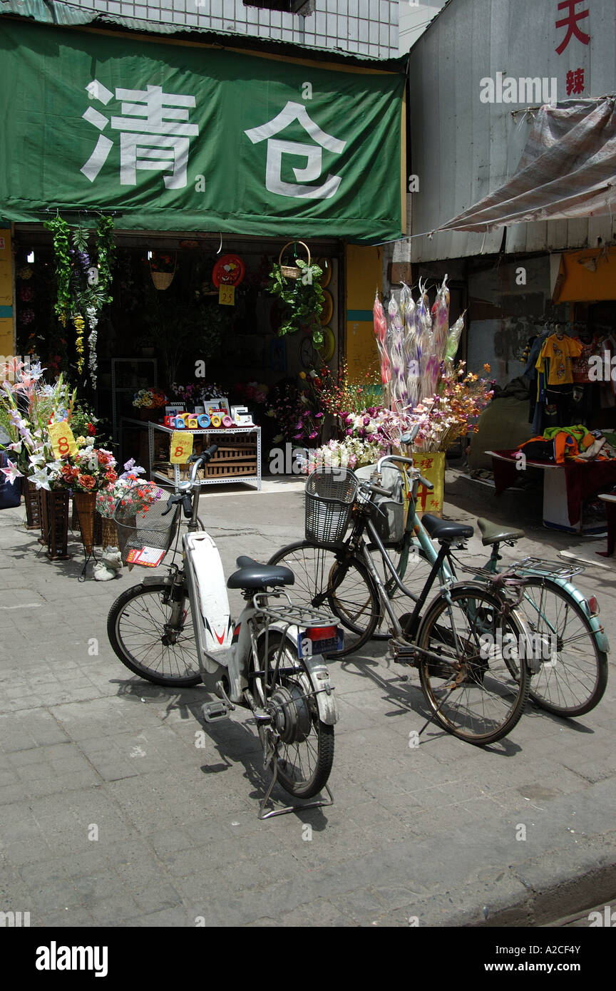 Bikes outside local shop, Chengdu China Stock Photo - Alamy