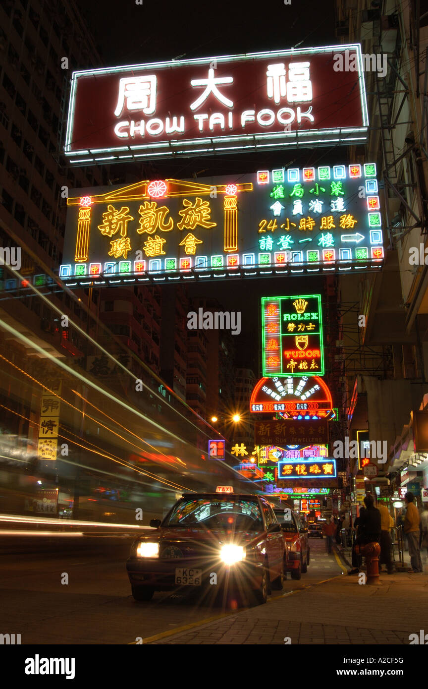 Light trail of bus passing neon signs on Nathan Road, Kowloon Hong Kong ...