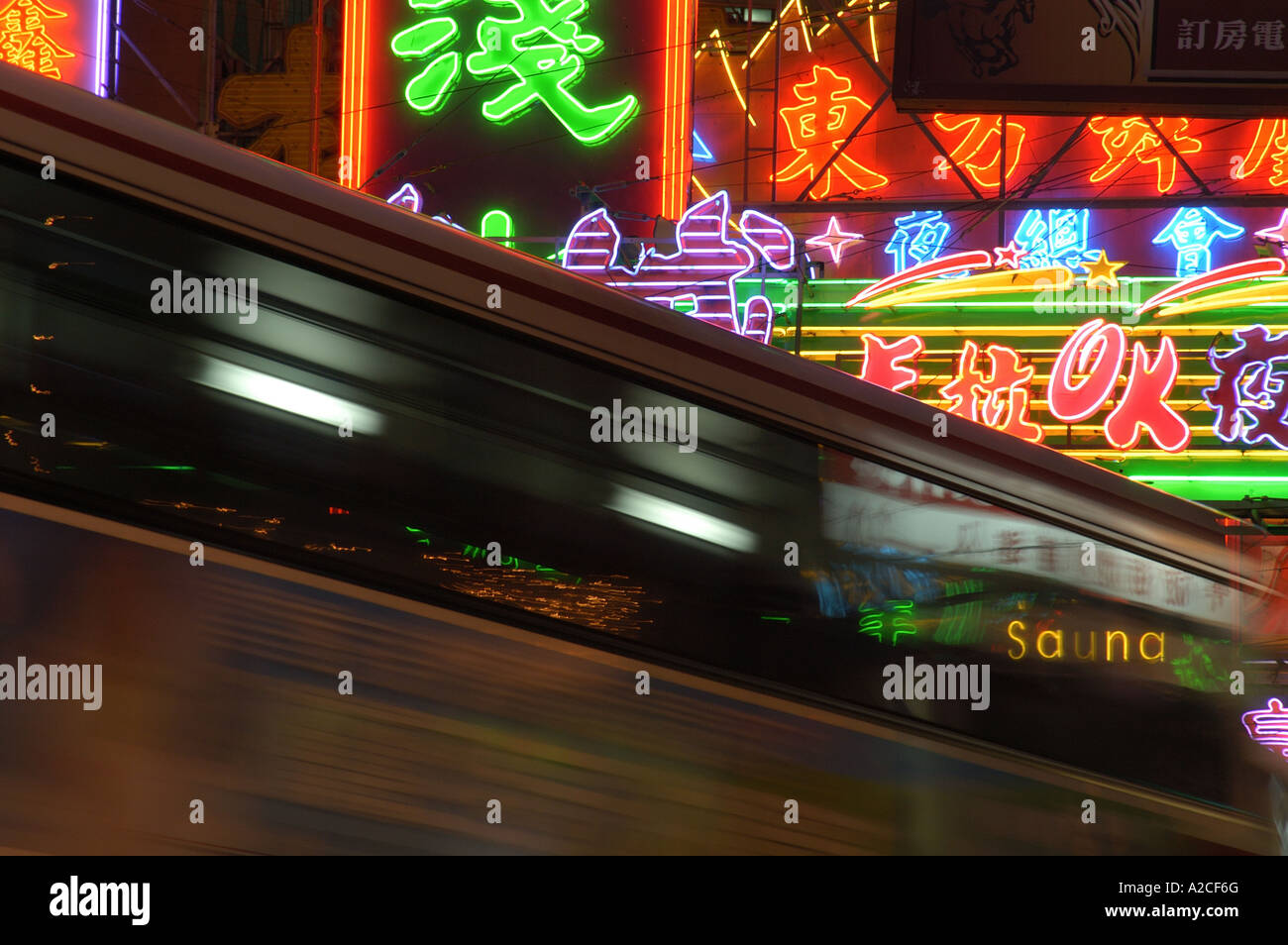 Bus passing neon signs on Nathan Road, Kowloon Hong Kong Stock Photo ...