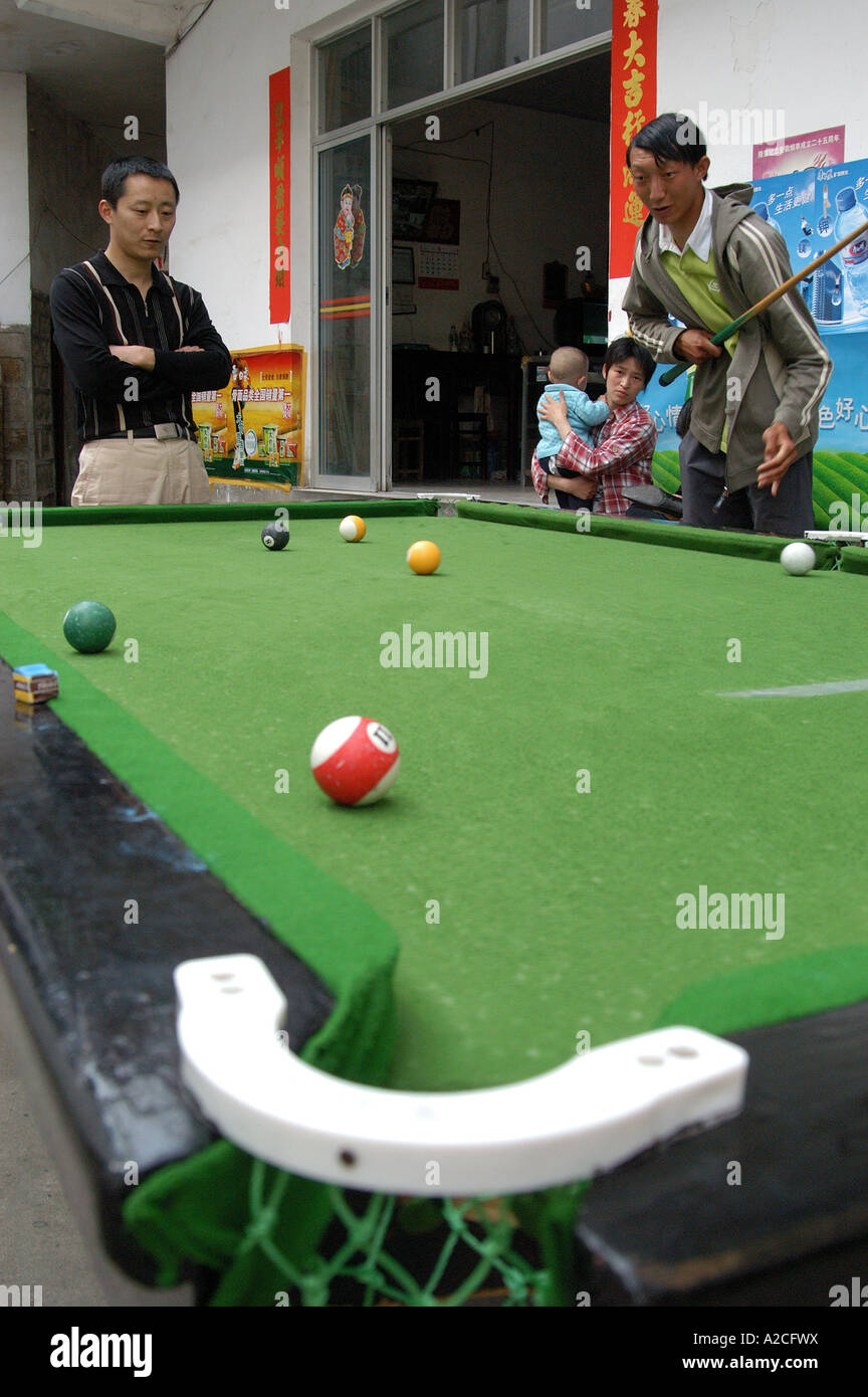 Local men playing pool in the village at the foot of Yellow Mountain ...