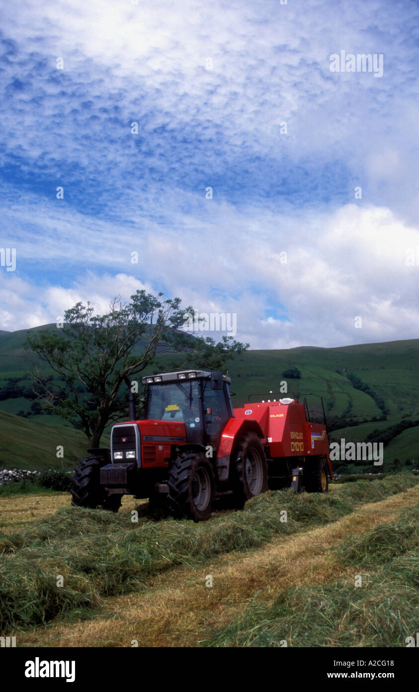 Making high density silage bales Stock Photo - Alamy