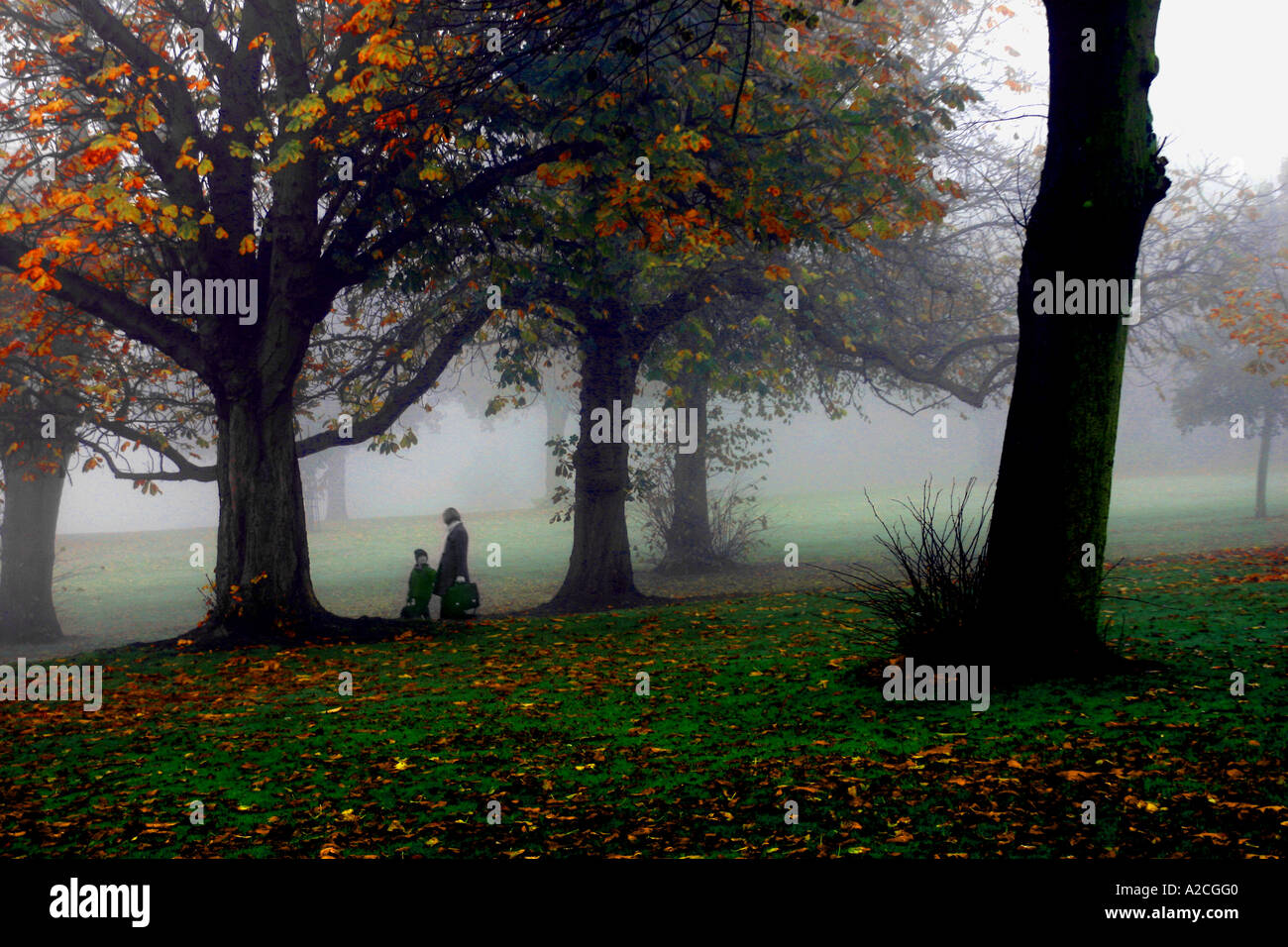Mother and Child walking through park to school. Suffolk. East Anglia ...