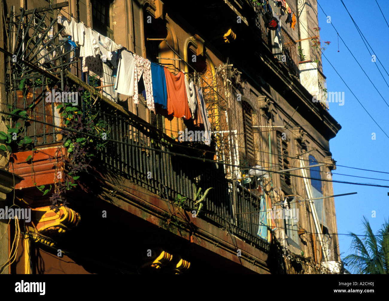 Clothes hung out to dry on a washing line on a balcony of a colonial ...
