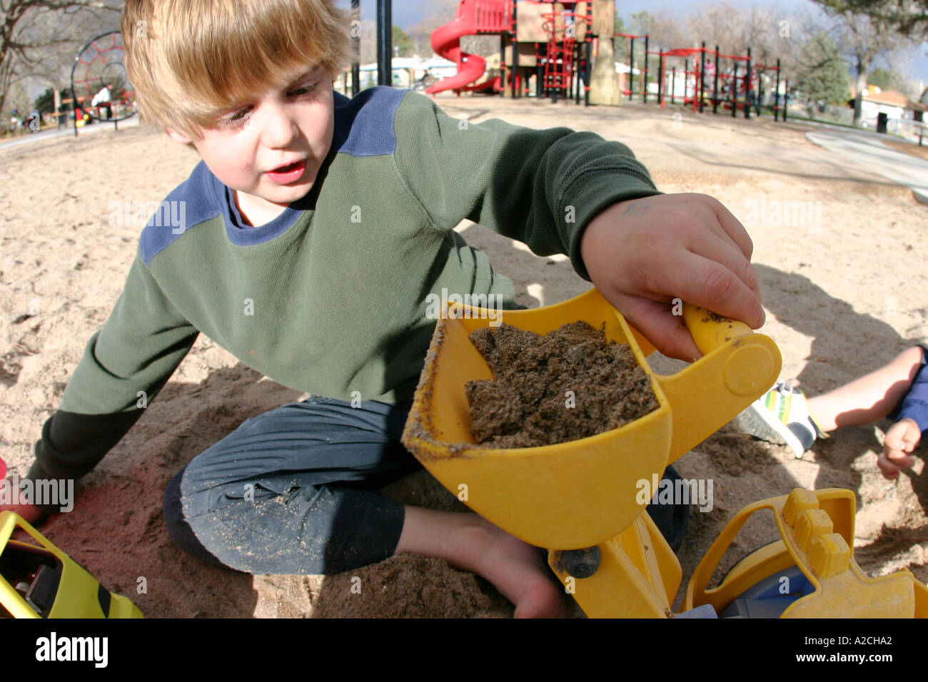 boy playing in sand at park Stock Photo - Alamy