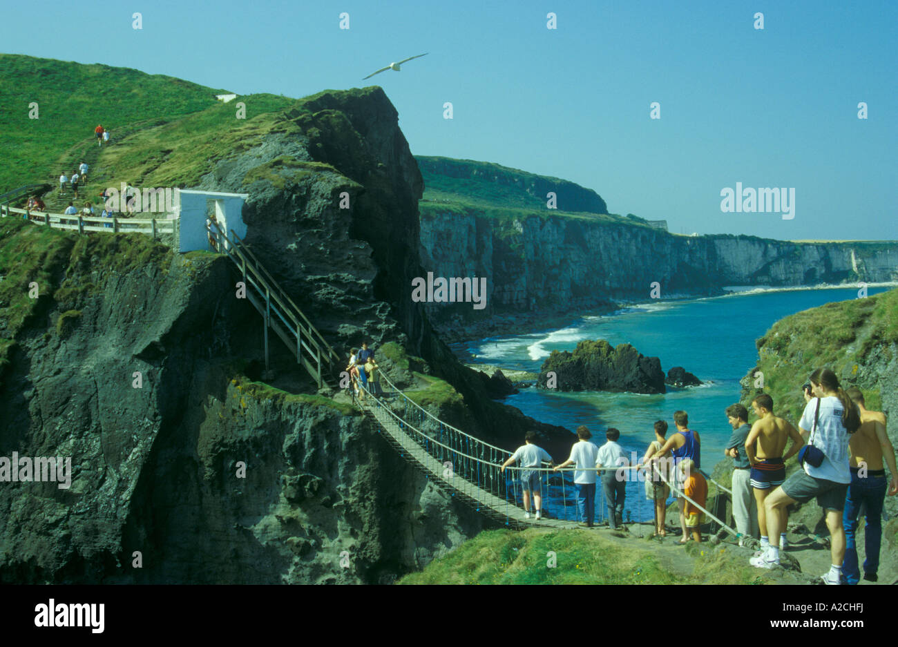 people are queuing to cross the rope bridge from Carrick-a-Rede Island ...