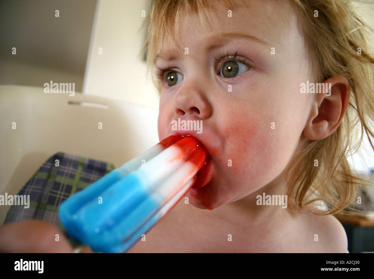toddler eating red white blue popsicle Stock Photo - Alamy