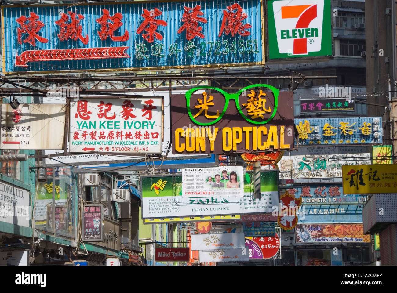 Many shop signs and billboards above street in Kowloon Hong Kong Stock ...