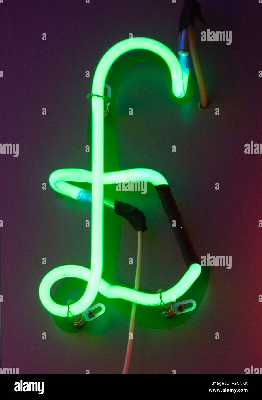 Neon signs in shape of pound sterling Stock Photo - Alamy