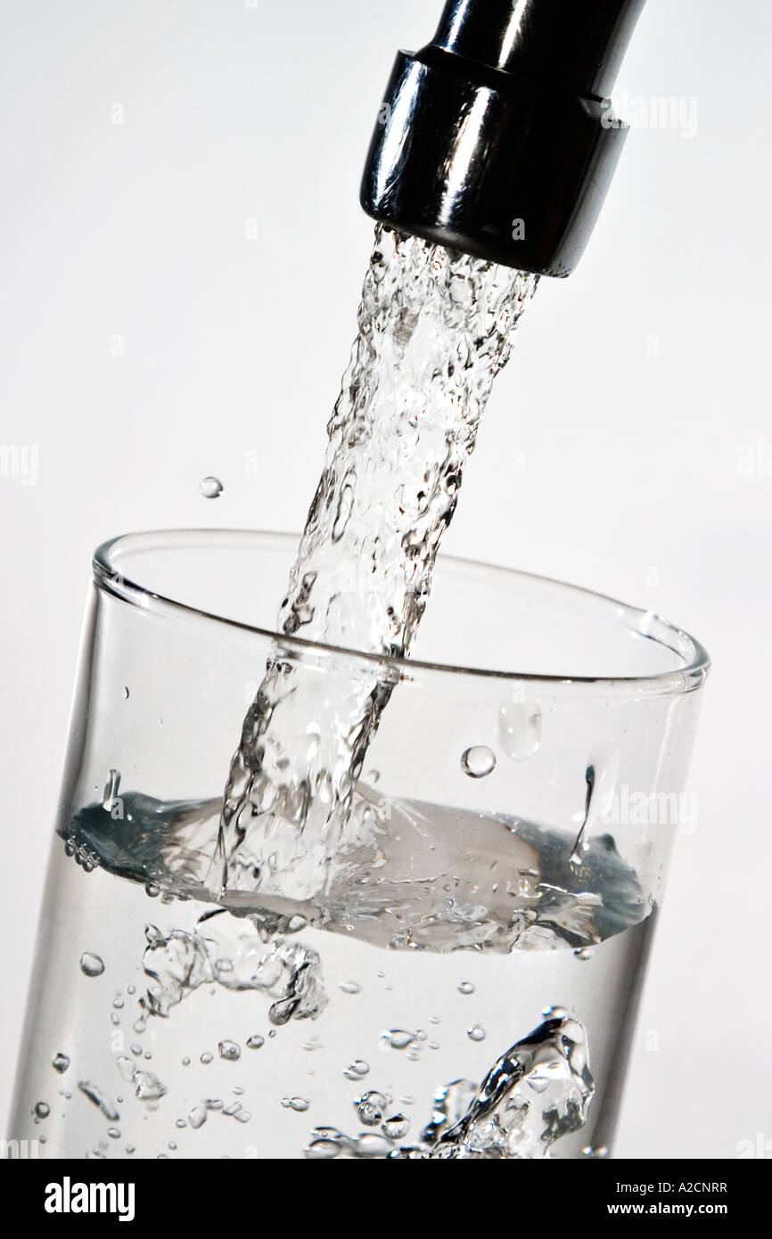 Glass filled straight from the tap hi-res stock photography and images ...