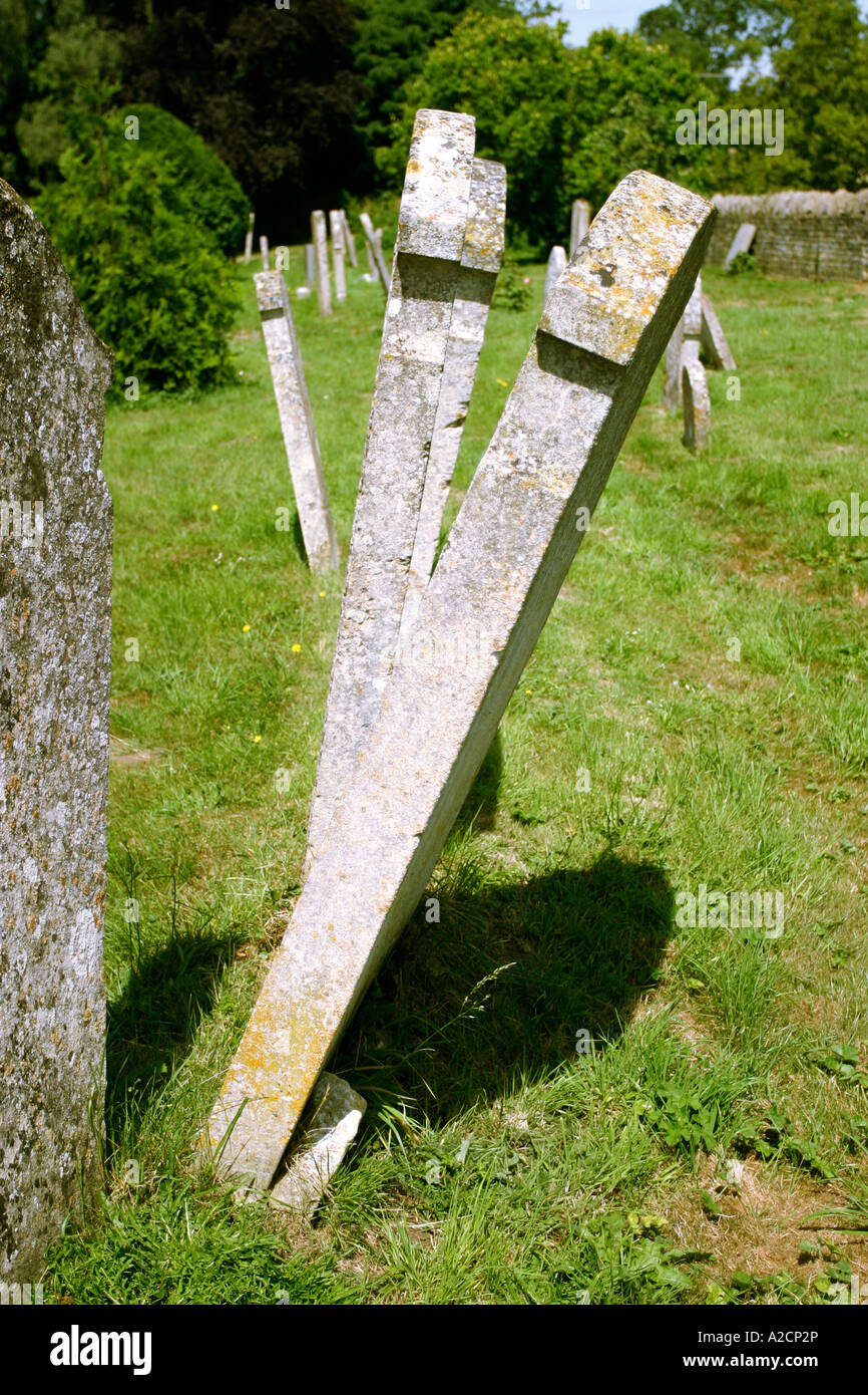 Falling Grave stones at a churchyard in Northamptonshire Stock Photo ...