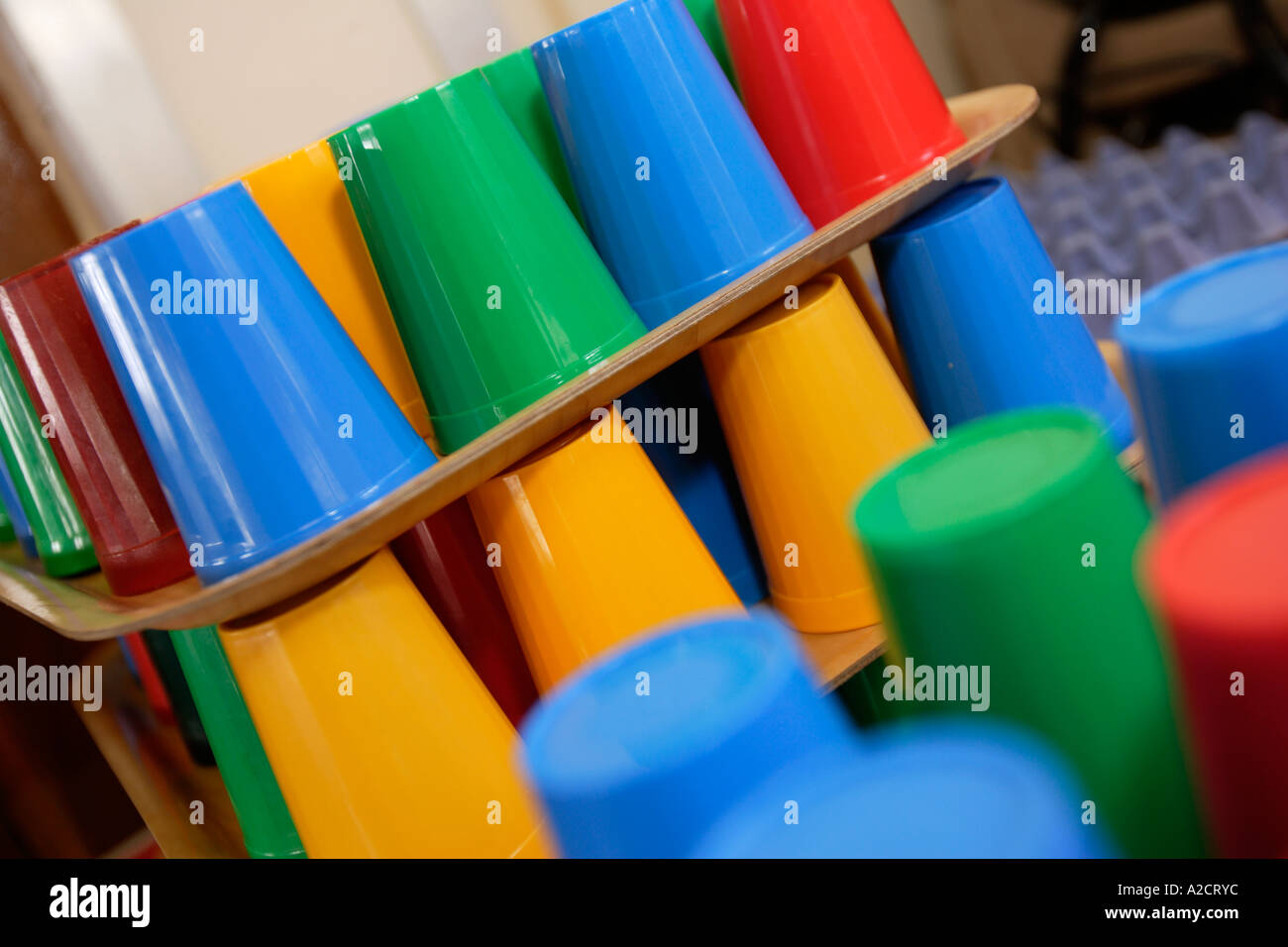 Close up of colourful cups in a school canteen Stock Photo - Alamy