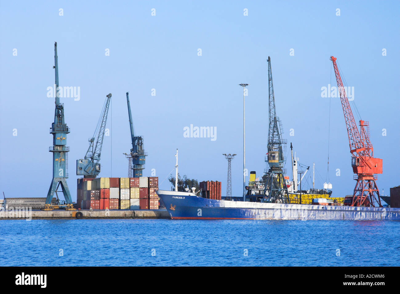 Ocean going ships unloading their cargo in the port of Mersin Turkey ...
