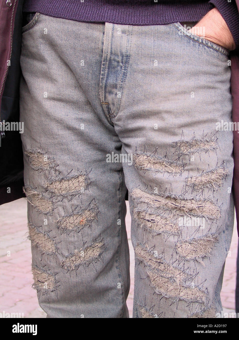 Sewed up jeans on a male Stock Photo - Alamy