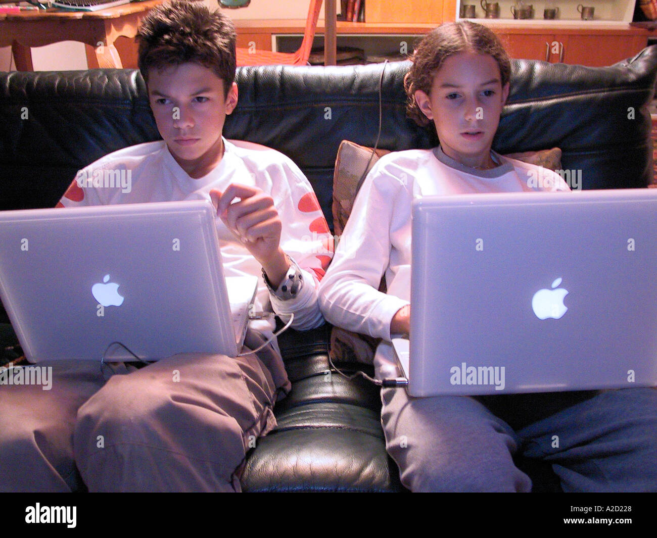 Boy and girl with laptop computers Stock Photo - Alamy