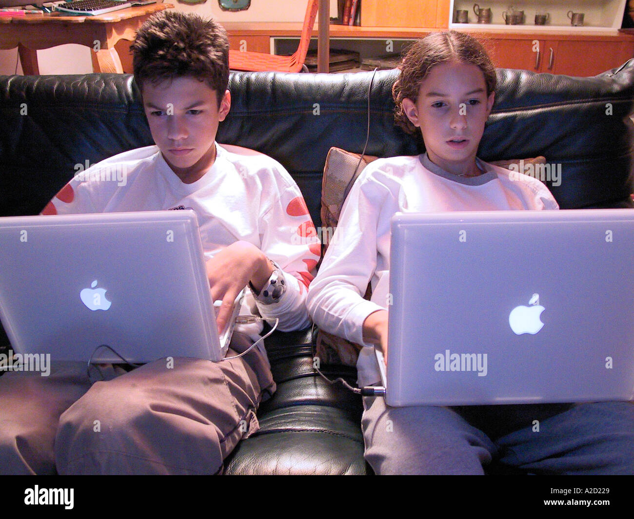 Boy and girl with laptop computers Stock Photo - Alamy
