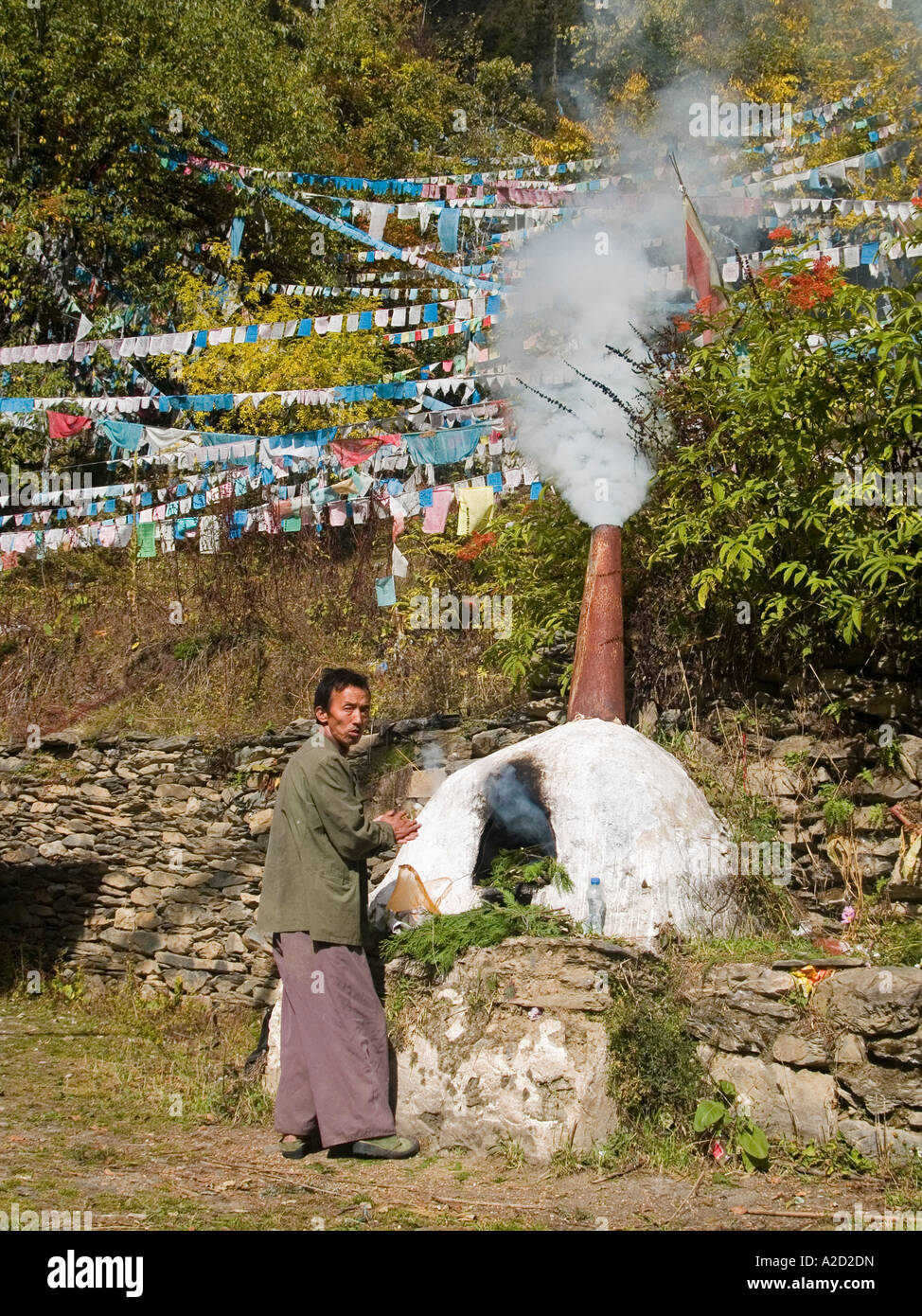 Tibetan man burning juniper as prayer offering Meili Snow Mountains ...