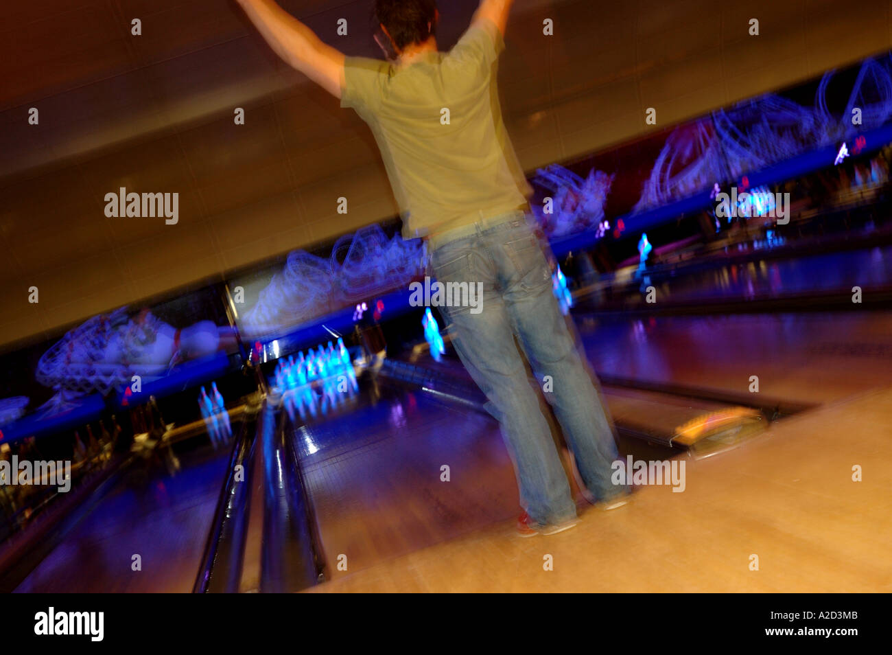 Person celebrating a Strike in a bowling alley Stock Photo - Alamy