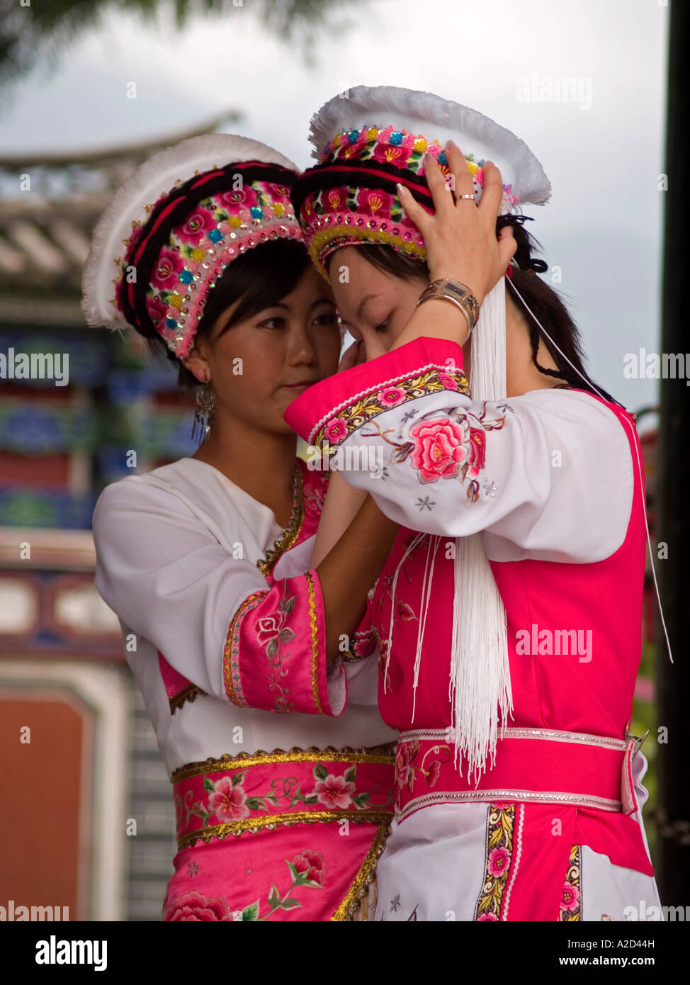 gals in traditional Bai costume getting dressed Dali China Stock Photo ...