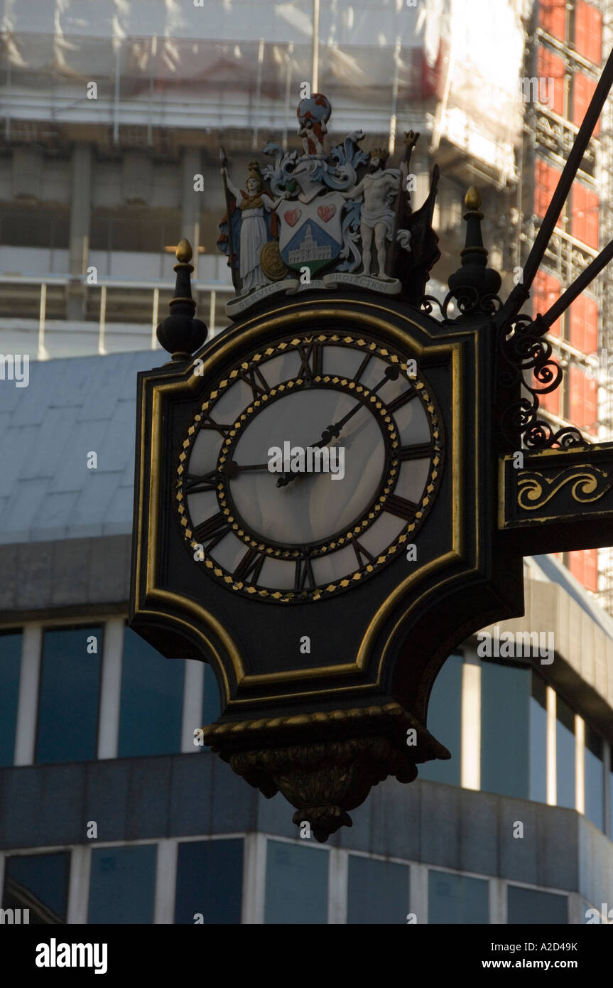 Ornate clock face outside the Royal exchange in the city of London ...
