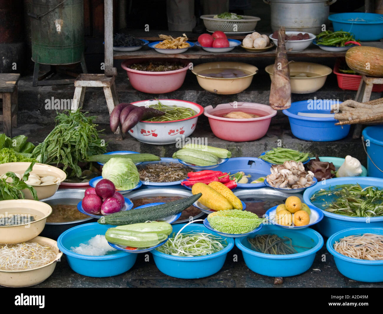 fresh vegetables displayed in front of restaurant Dali China Stock ...