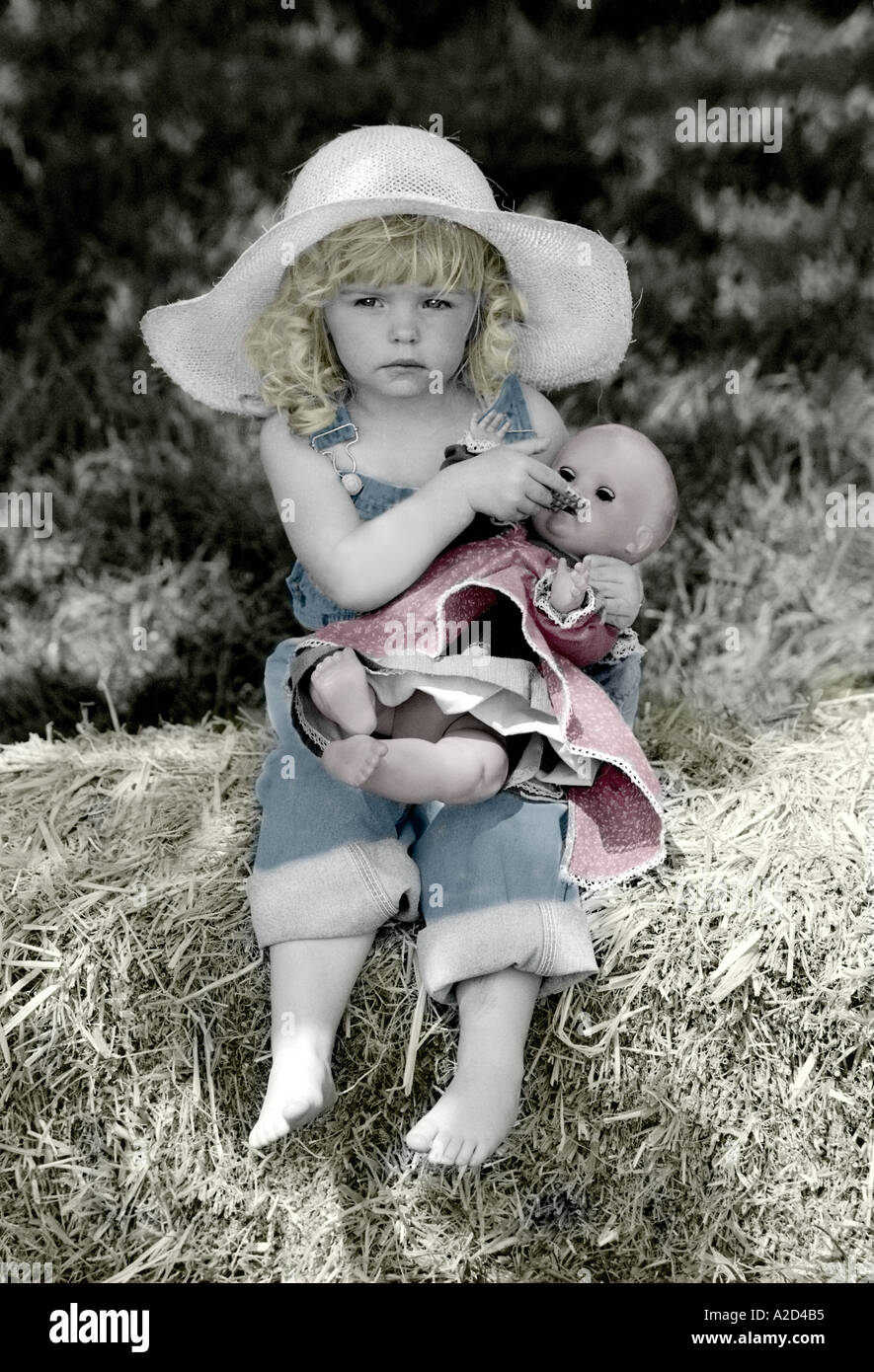 little girl with doll Stock Photo - Alamy