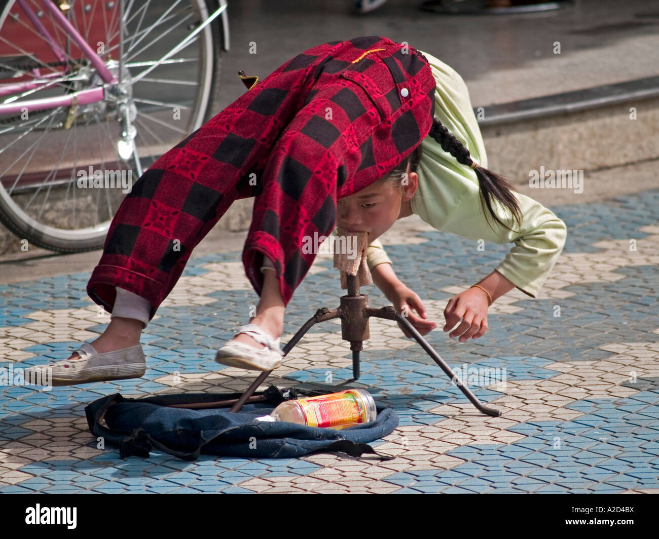 Chinese girl doing amazing things Lijiang China Stock Photo - Alamy