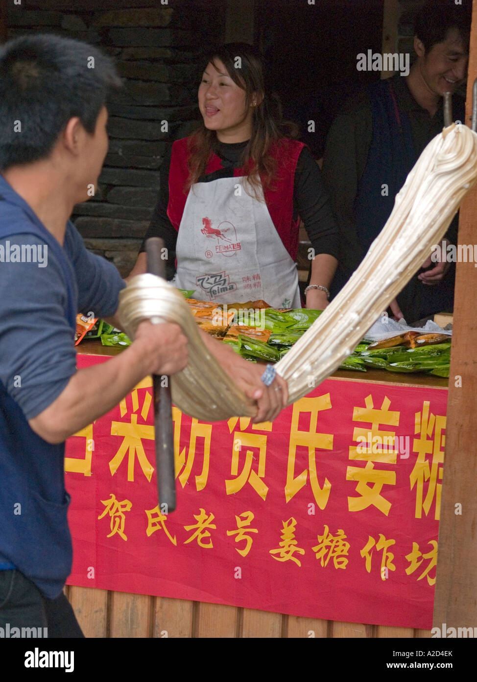 pulling taffy Lijiang China Stock Photo - Alamy