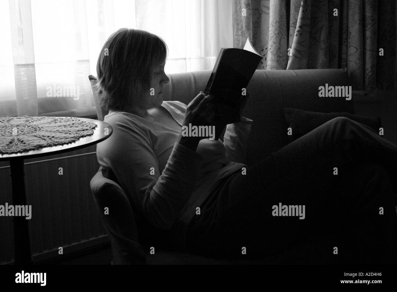Woman reading story book Black and White Stock Photos & Images - Alamy