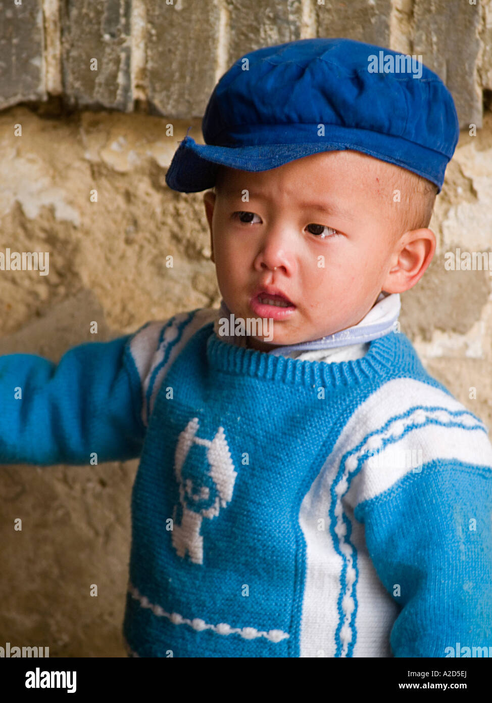 sad boy Yuanyang market China Stock Photo - Alamy