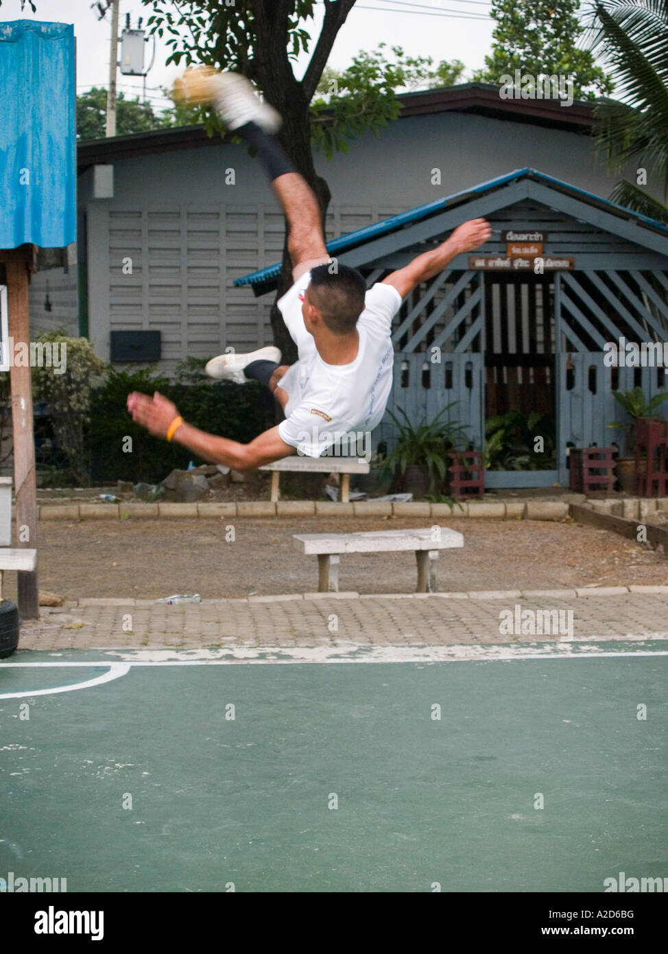 Thai guy goes airborne for a kick playing sepak takraw Thailand Stock ...