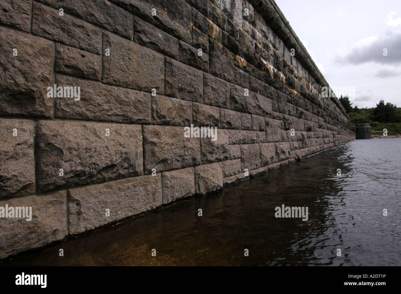 A shot of the dam wall at Fernworthy reservoir showing the low water ...