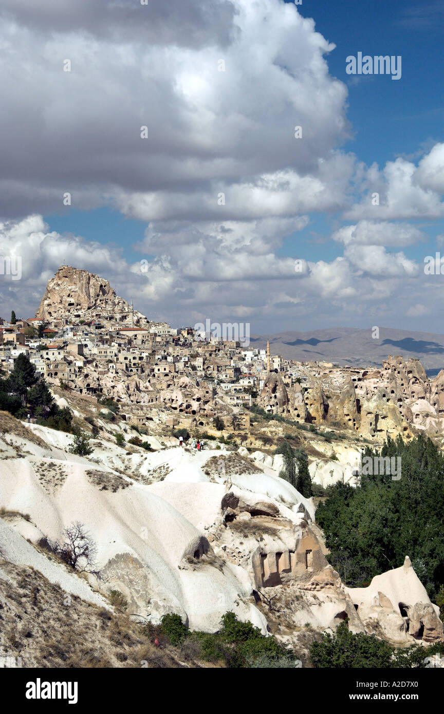 The volcanic landscape of cone shaped rock carved caves and dwellings ...