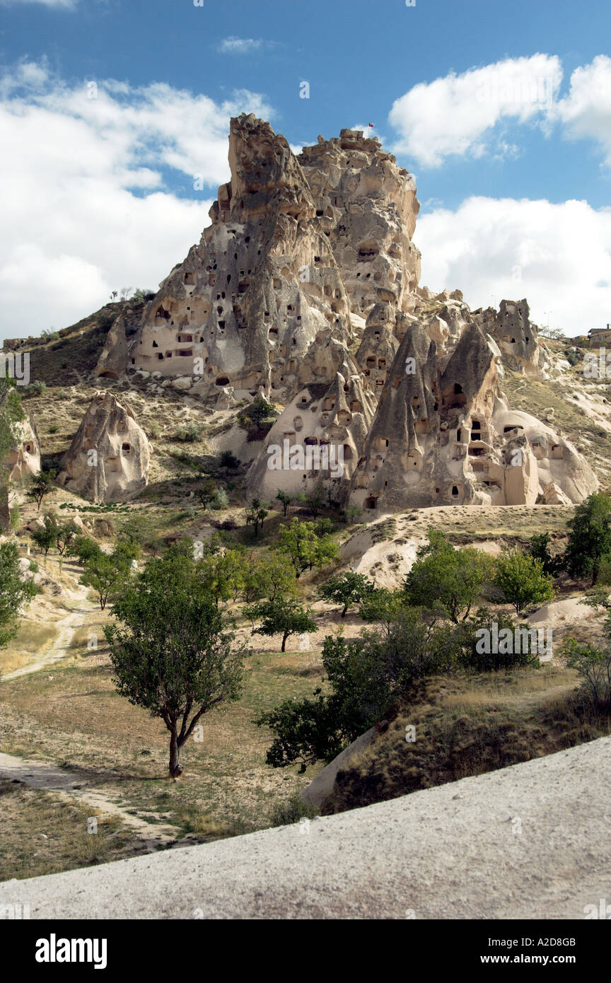 The volcanic landscape of cone shaped rock carved caves and dwellings ...