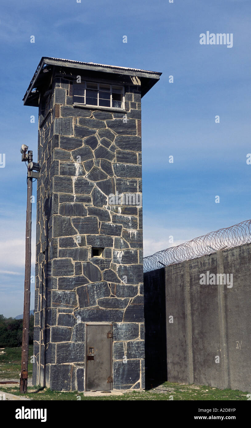 watch tower and barbed wire fence around the old prison, Robben Island ...