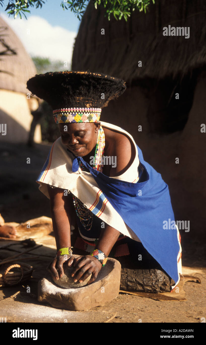 Zulu Married Woman Wearing A Traditional Hat Grinding Maize Kwazulu