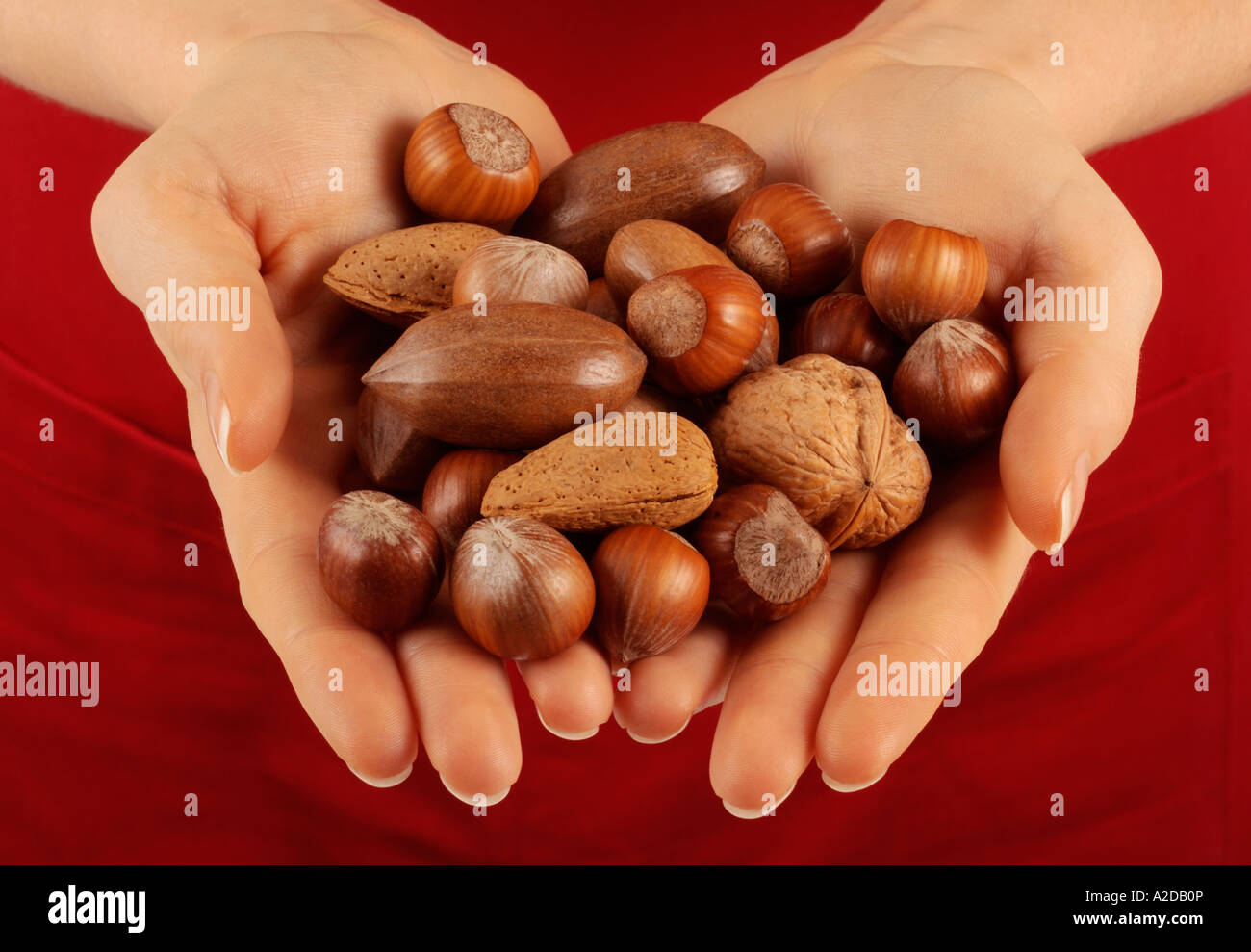 Handful of nuts hand mixed hi-res stock photography and images - Alamy