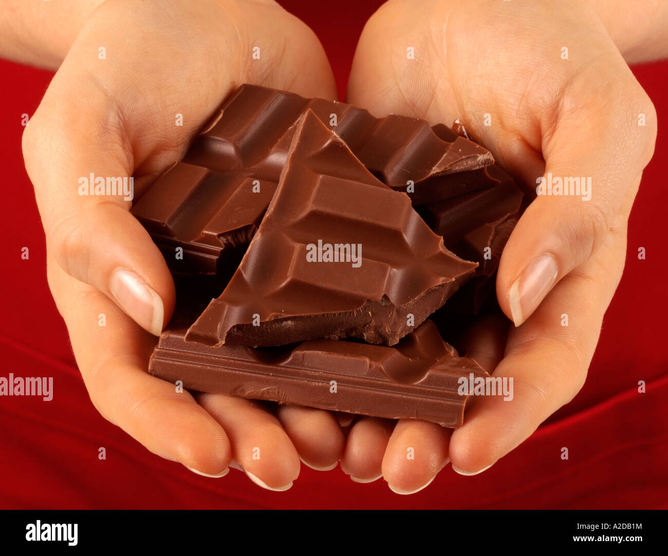 Woman binging on chocolate hi-res stock photography and images - Alamy