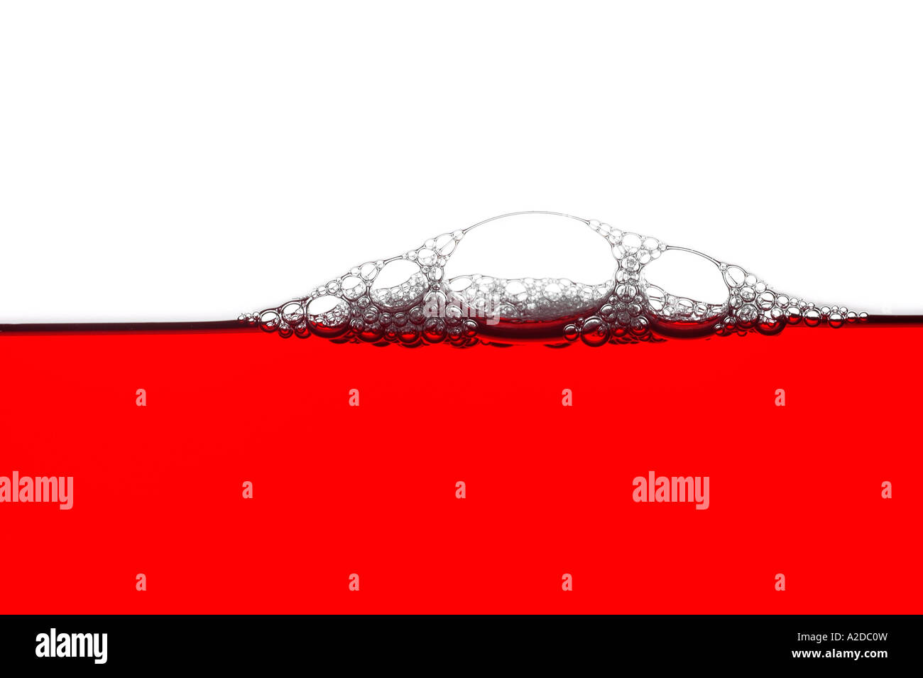 Bubbles on red water Stock Photo - Alamy