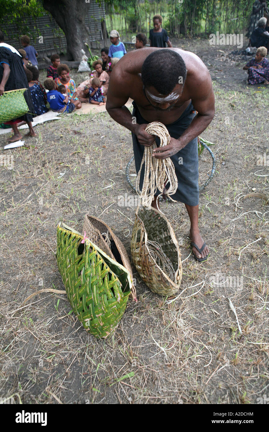 Tolai man distributing shell money for use in a Tolai Death Ceremony ... Tolai man distributing shell money for use in a Tolai Death Ceremony ...