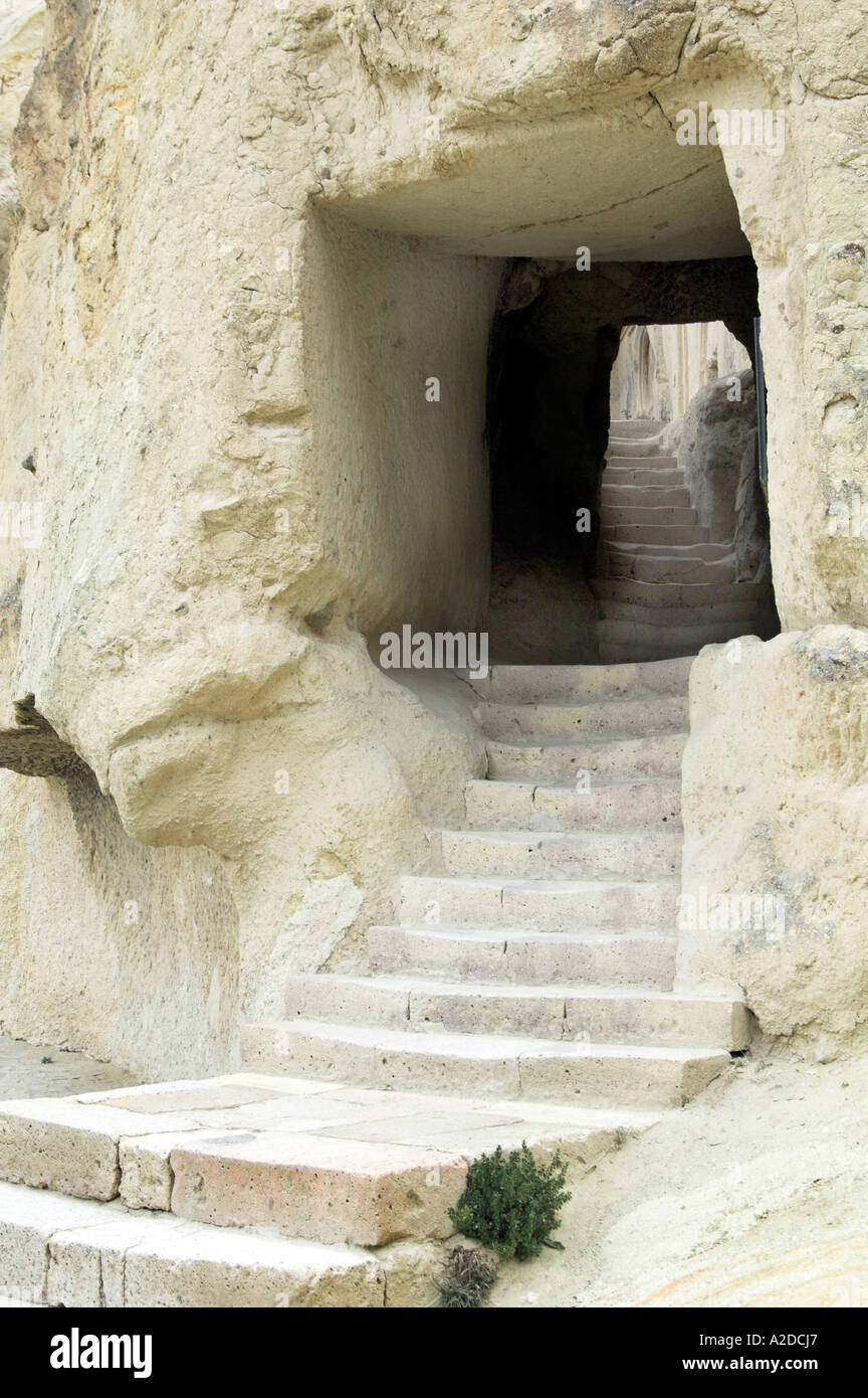 Doors and arches leading to cave interiors carved into the volcanic ...