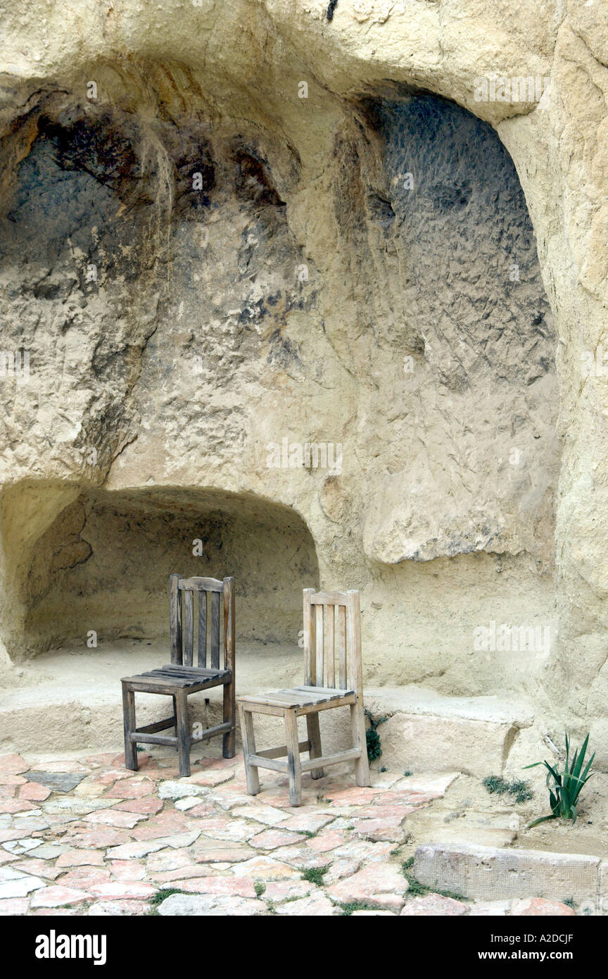 Doors and arches leading to cave interiors carved into the volcanic ...