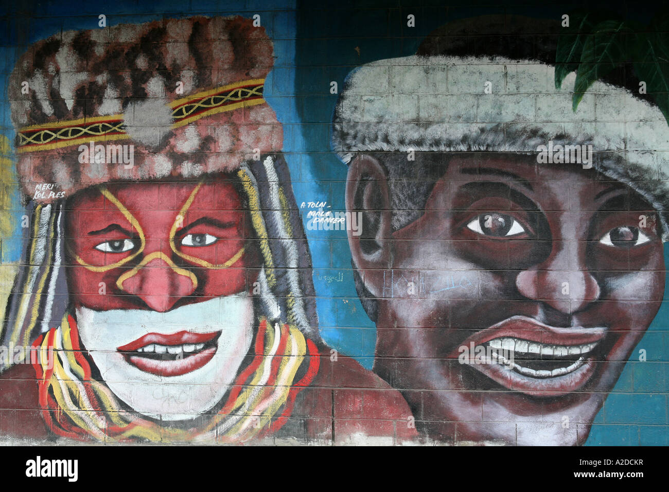 Mural depicting Tolai male dancers on a warehouse wall in Rabaul, East ...