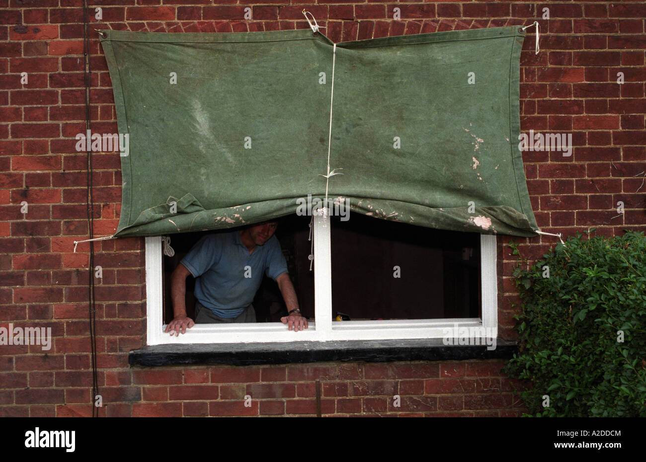 Home owner renovating a window of his Suffolk home Stock Photo - Alamy