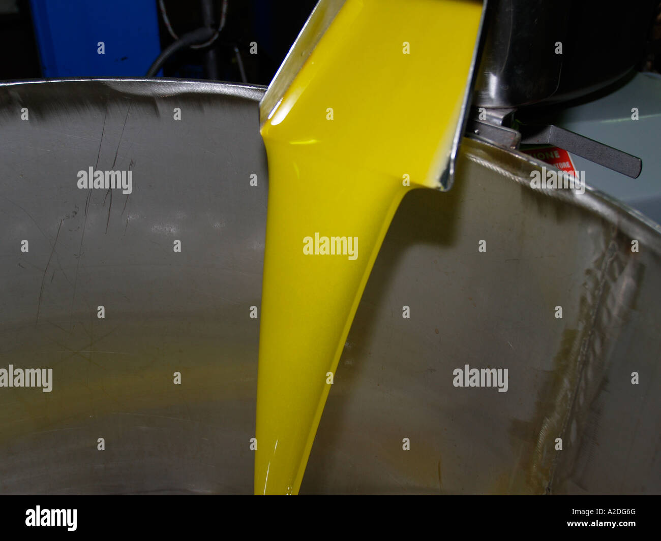 Olive oil running into vat Stock Photo - Alamy