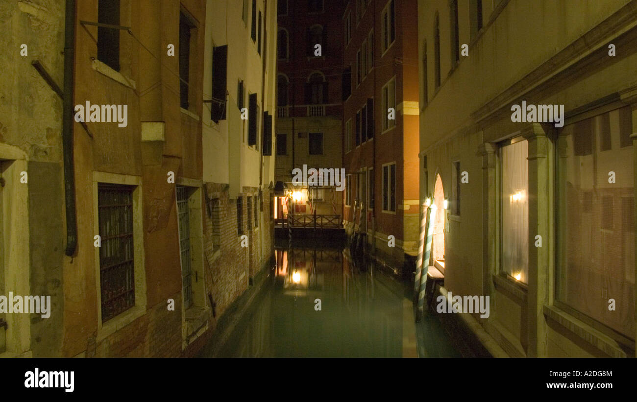 One of the many small waterways in Venice at night in December at ...